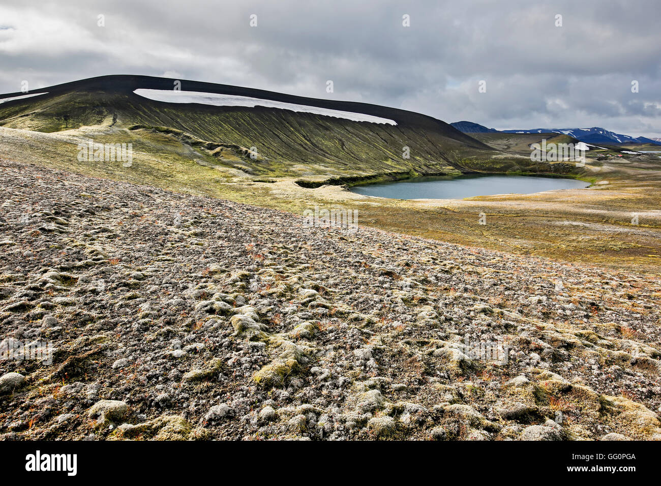 Mountain ridge, lake and lava field covered in moss, Veidivotn, Iceland ...