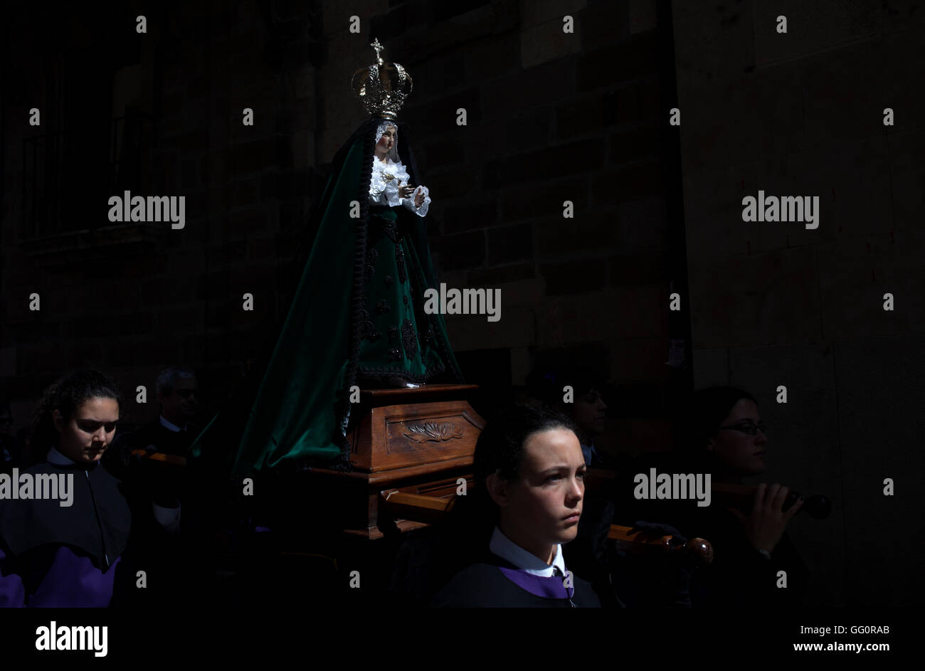 Female teenagers carry an image of the Virgin Mary during an Easter ...
