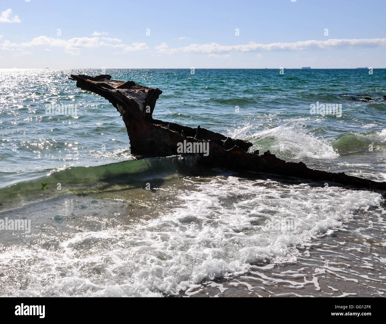Old rusted shipwreck partially submerged at CY O'Connor Beach and the ...