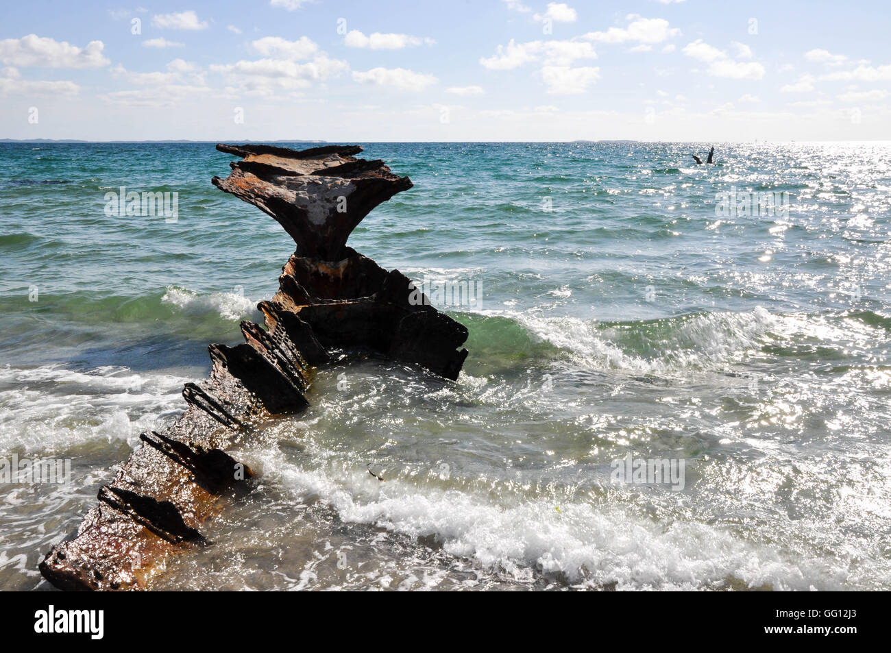 Old rusted shipwreck partially submerged at CY O'Connor Beach and the ...