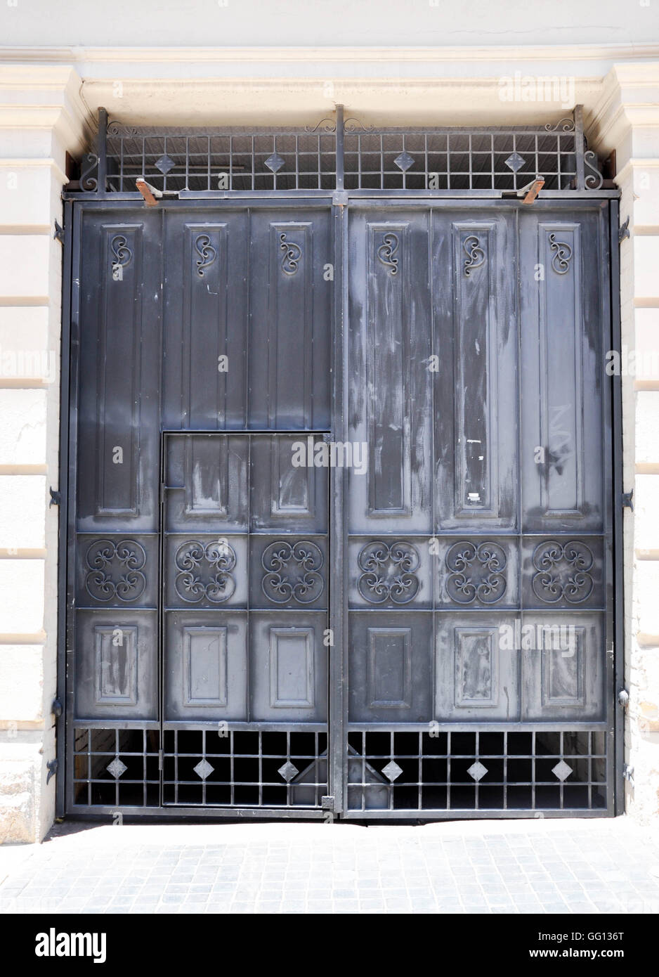 Unique, ornate metal gated doorway on building exterior Stock Photo - Alamy