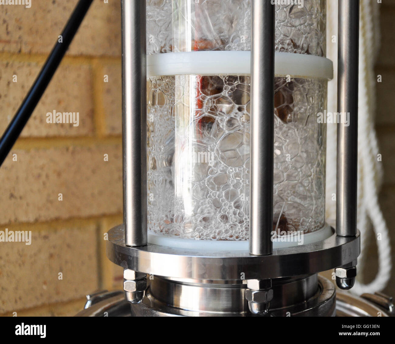 Bubble plate still with metal structure and glass walls filled with ...