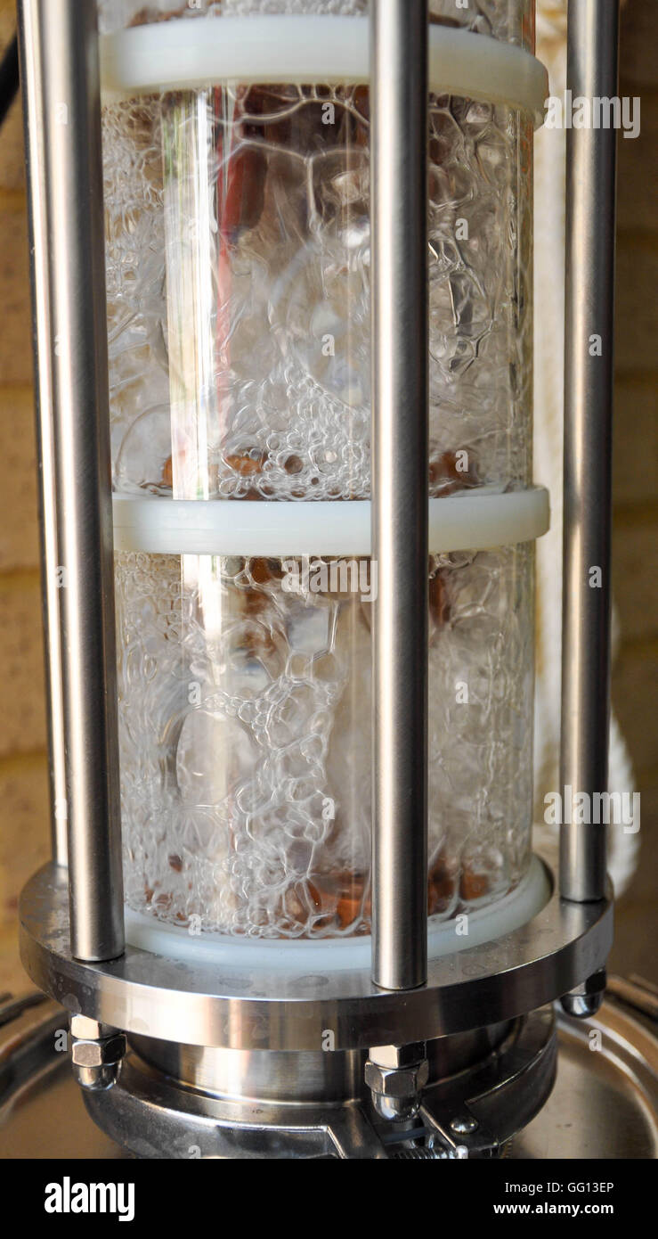 Bubble plate still with metal structure and glass walls filled with ...