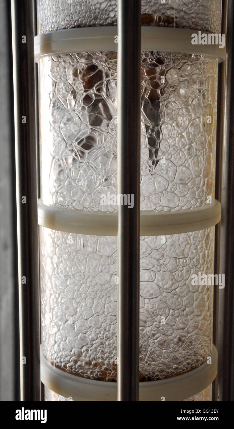 Bubble plate still with metal structure and glass walls filled with ...