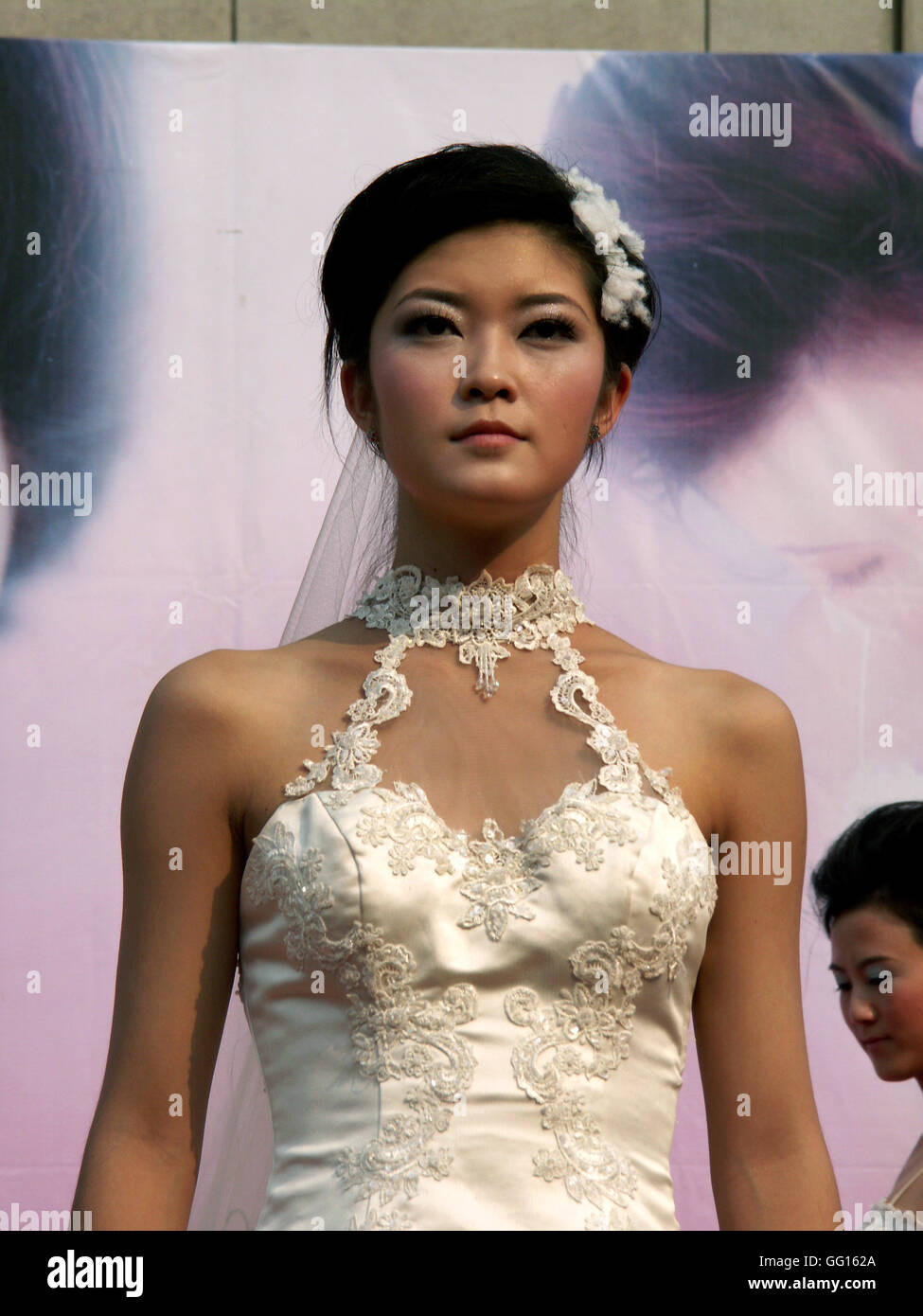 Fashion model showing a wedding dress at a fashion show in Beijing ...