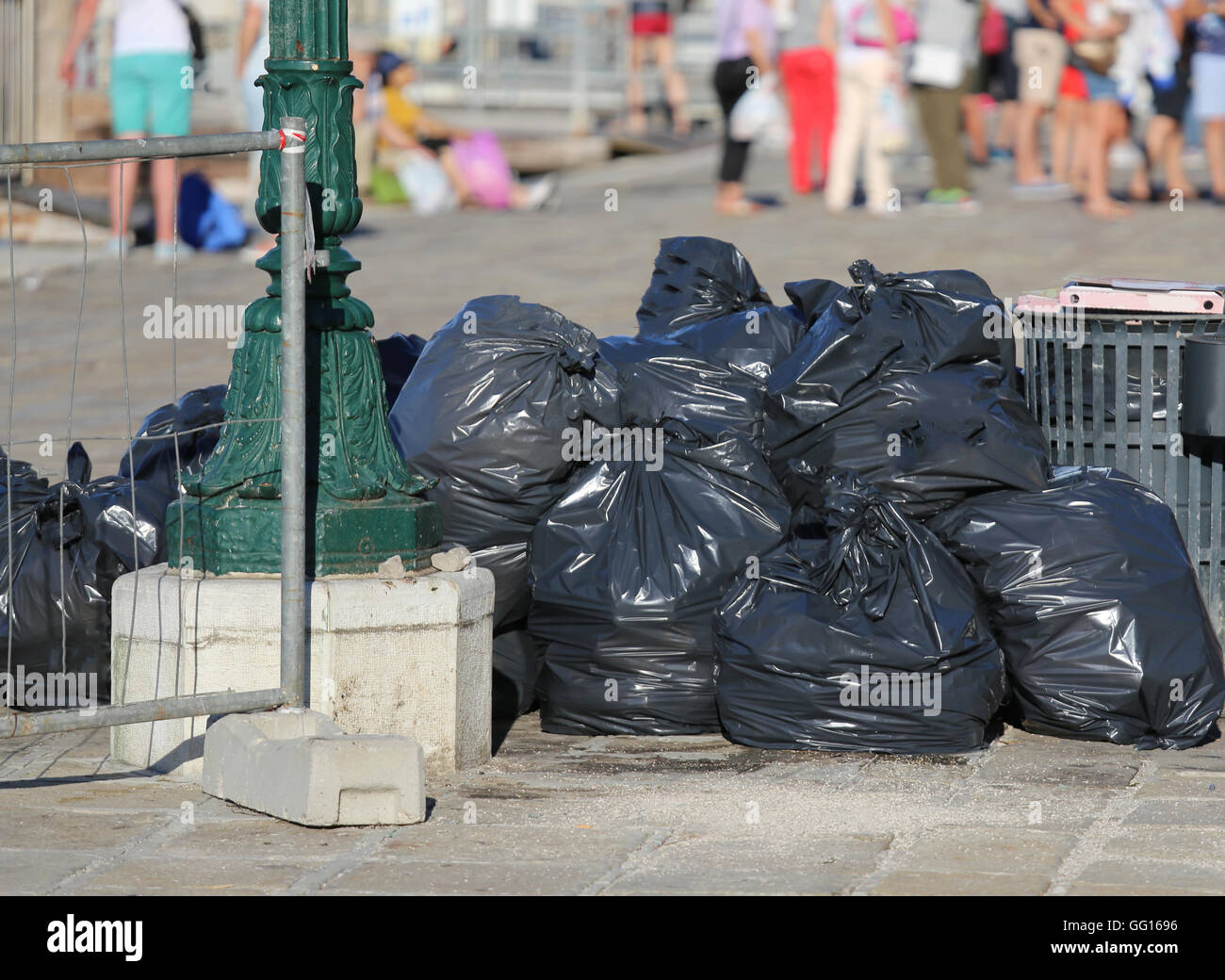 many black bags of garbage in the European tourist city Stock Photo - Alamy