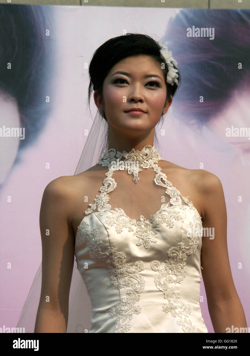 Fashion model showing a wedding dress at a fashion show in Beijing ...