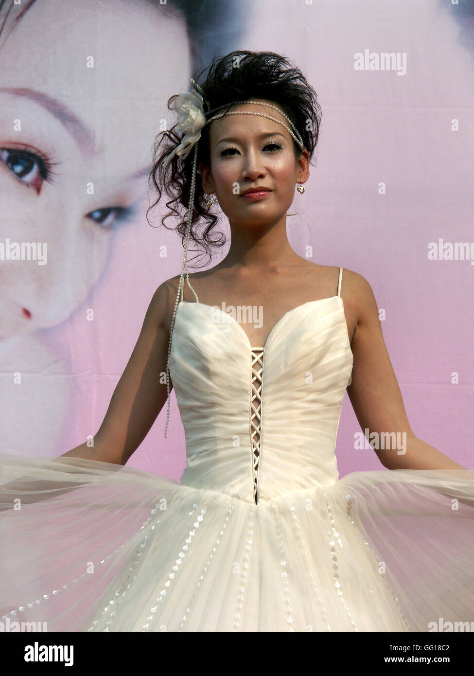 Fashion model showing a wedding dress at a fashion show in Beijing ...