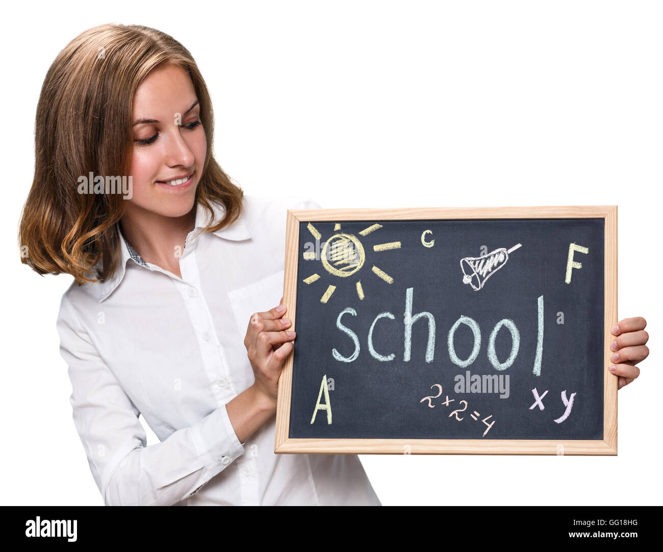 Young pretty girl holding and presents chalkboard school note isolated ...
