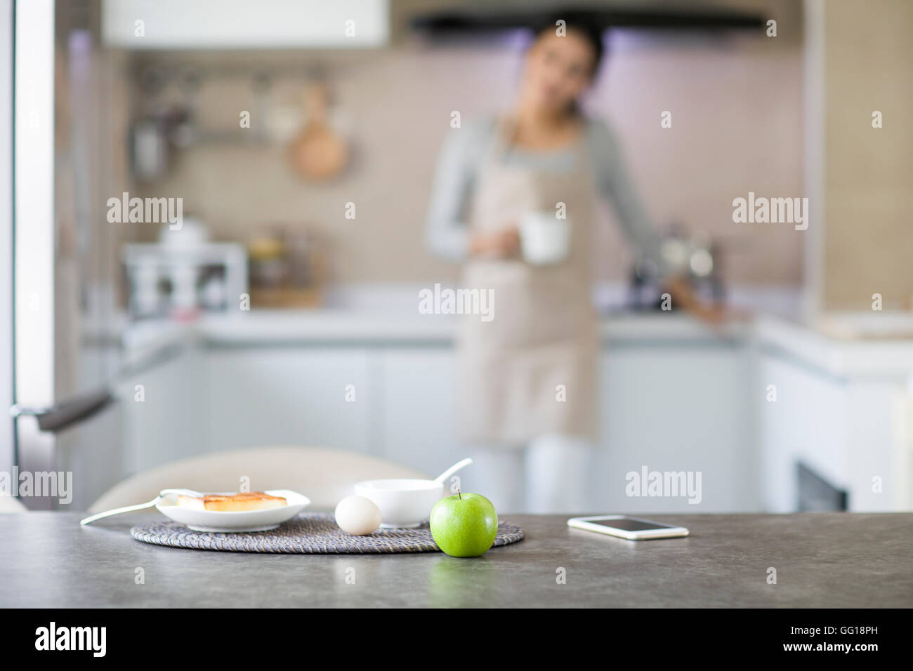 Young Chinese woman making breakfast at home Stock Photo - Alamy
