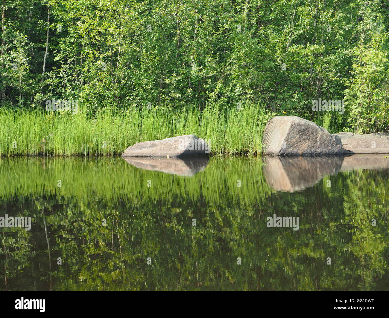 stones reflection in the lake Stock Photo - Alamy
