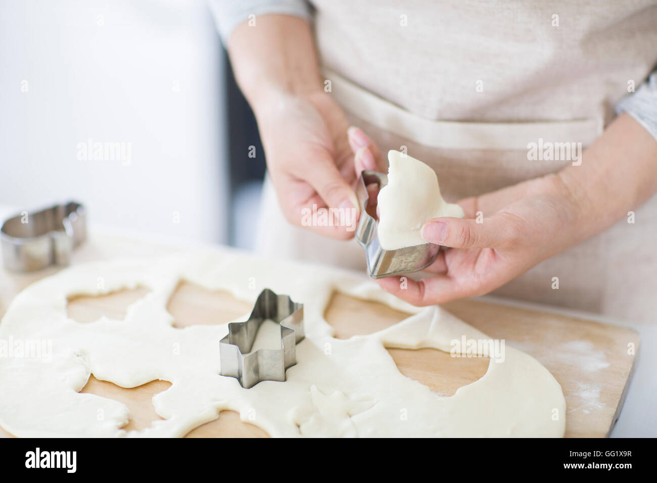 Young Chinese woman making cookies in kitchen Stock Photo - Alamy
