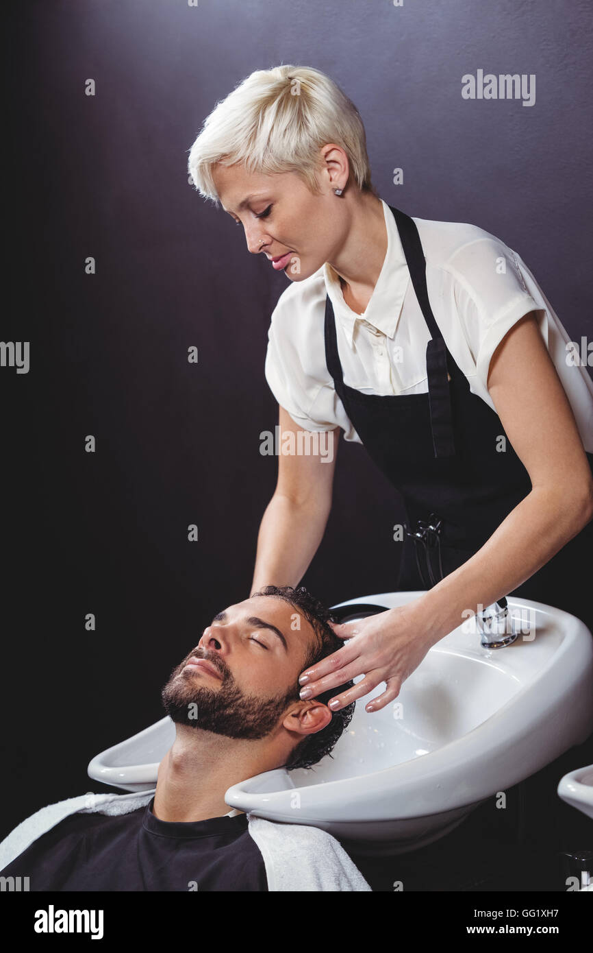 Man getting his hair wash Stock Photo - Alamy