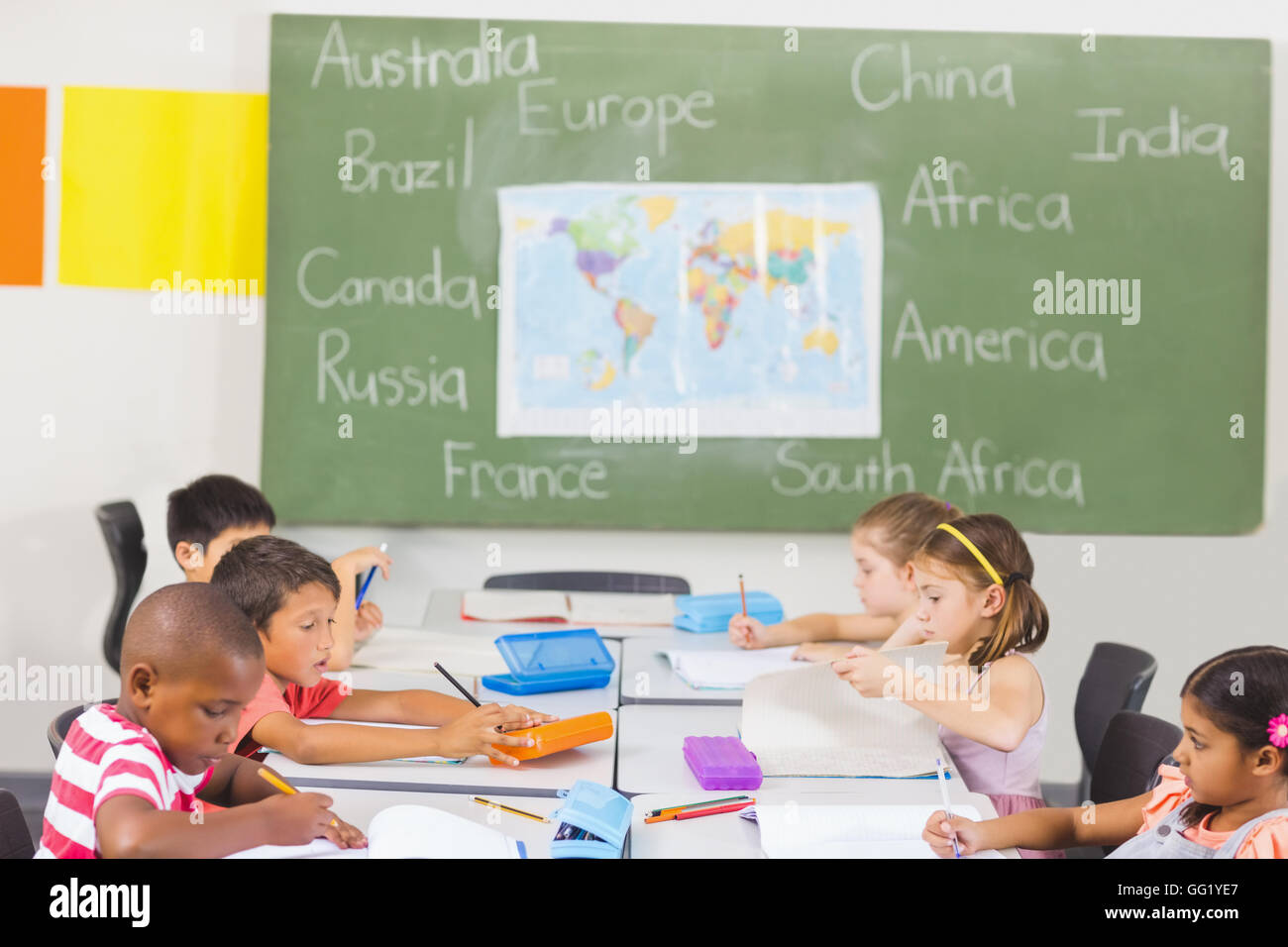 Kids studying in classroom Stock Photo - Alamy