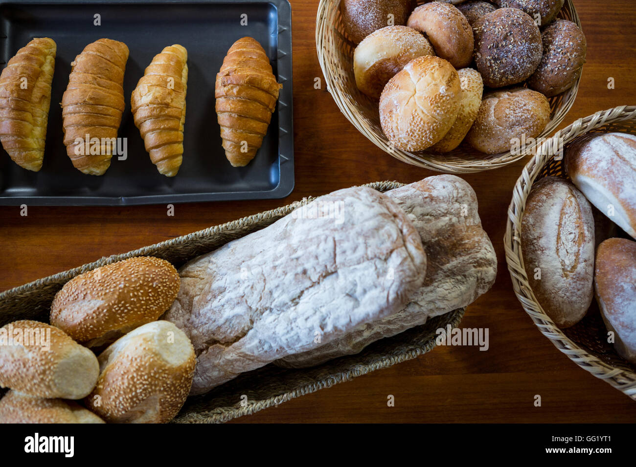 Close-up of various breads on display counter Stock Photo - Alamy
