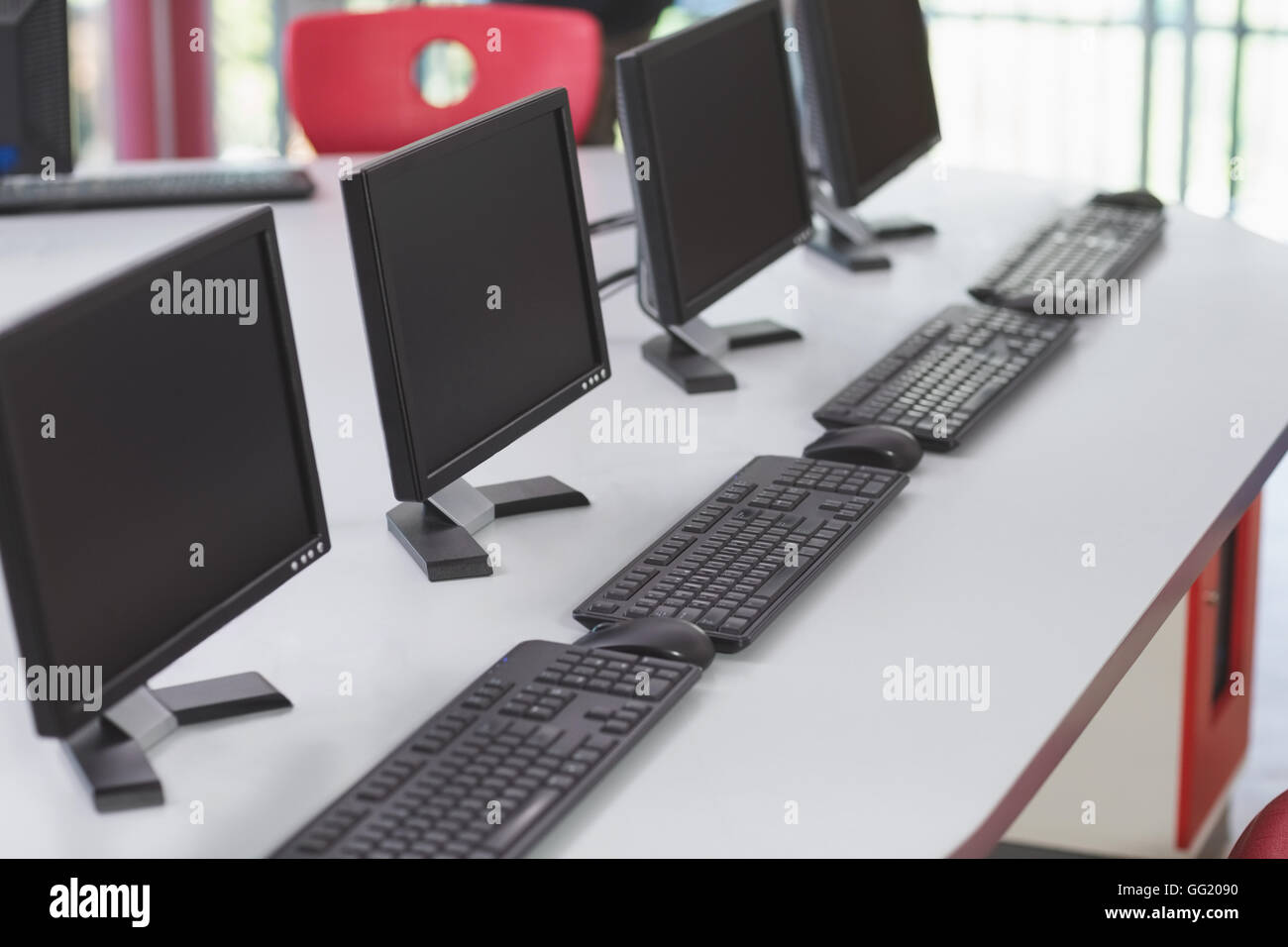 Computers in classroom Stock Photo - Alamy