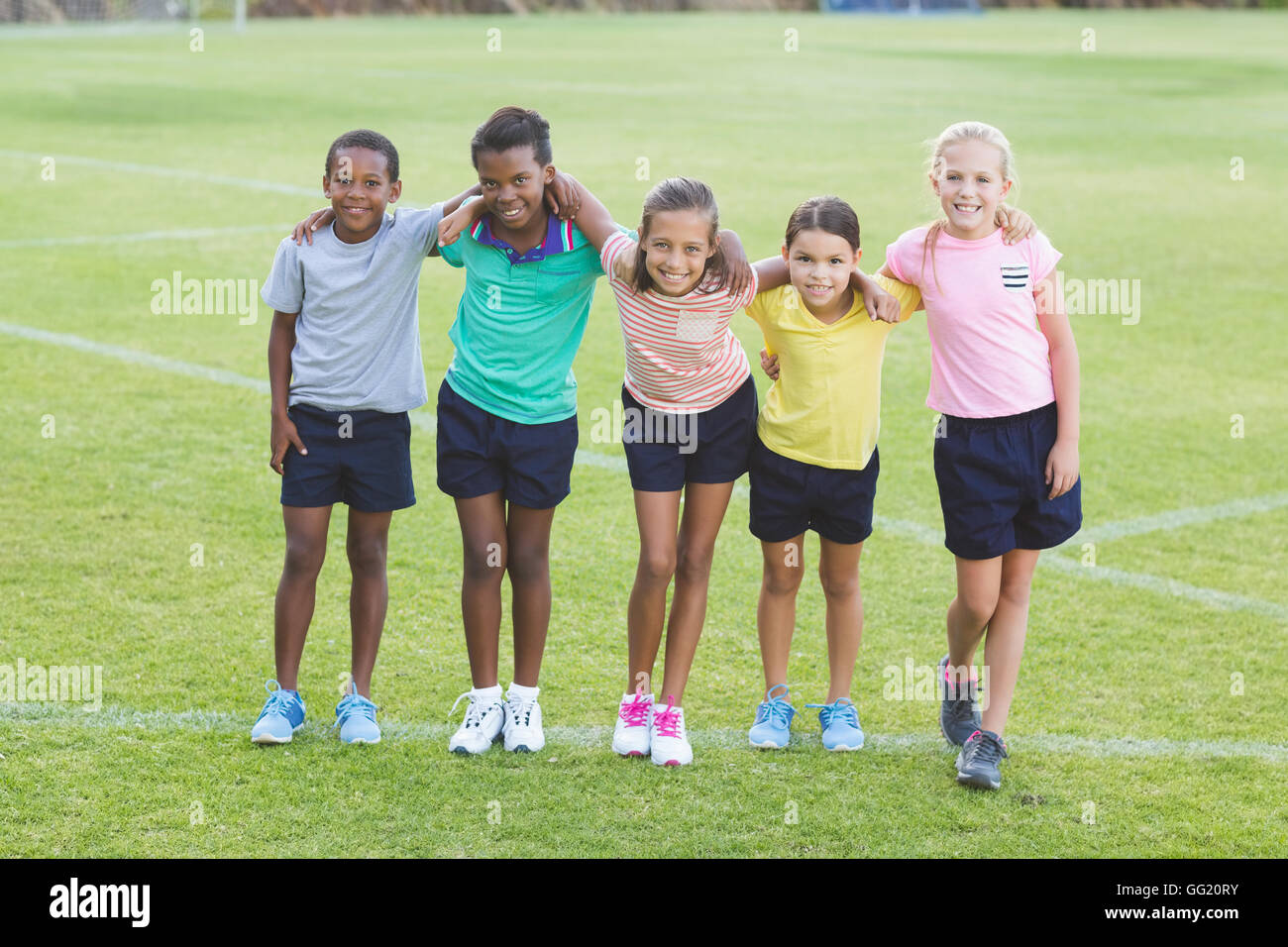 School kids standing with arms around Stock Photo - Alamy