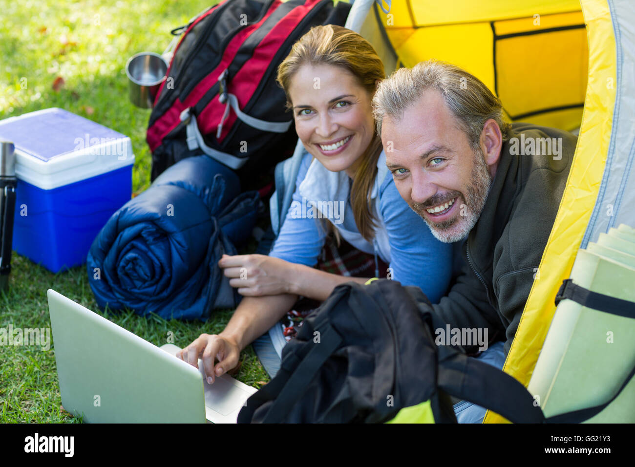 Portrait of hiker couple using laptop Stock Photo - Alamy