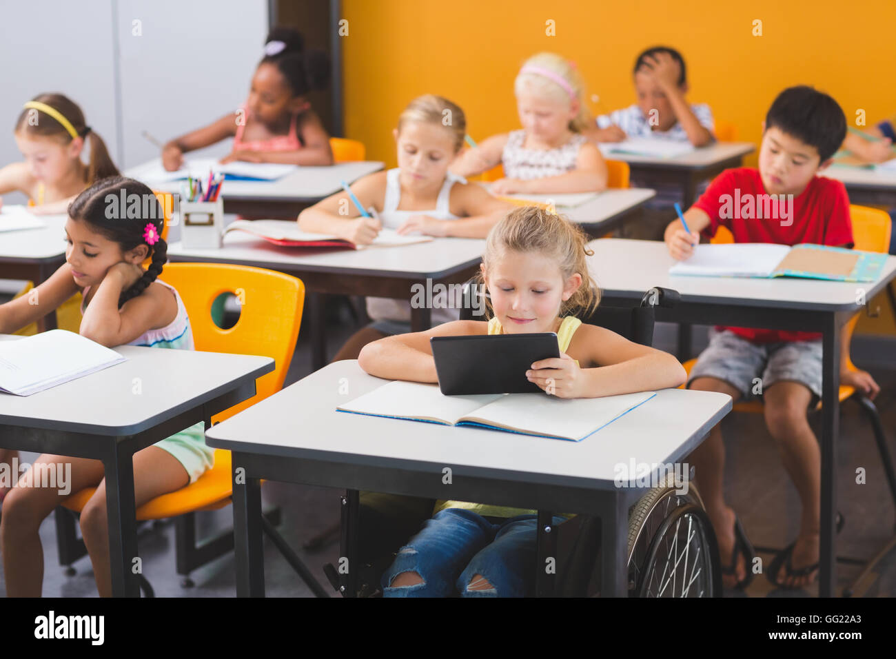 School kids studying in classroom Stock Photo - Alamy