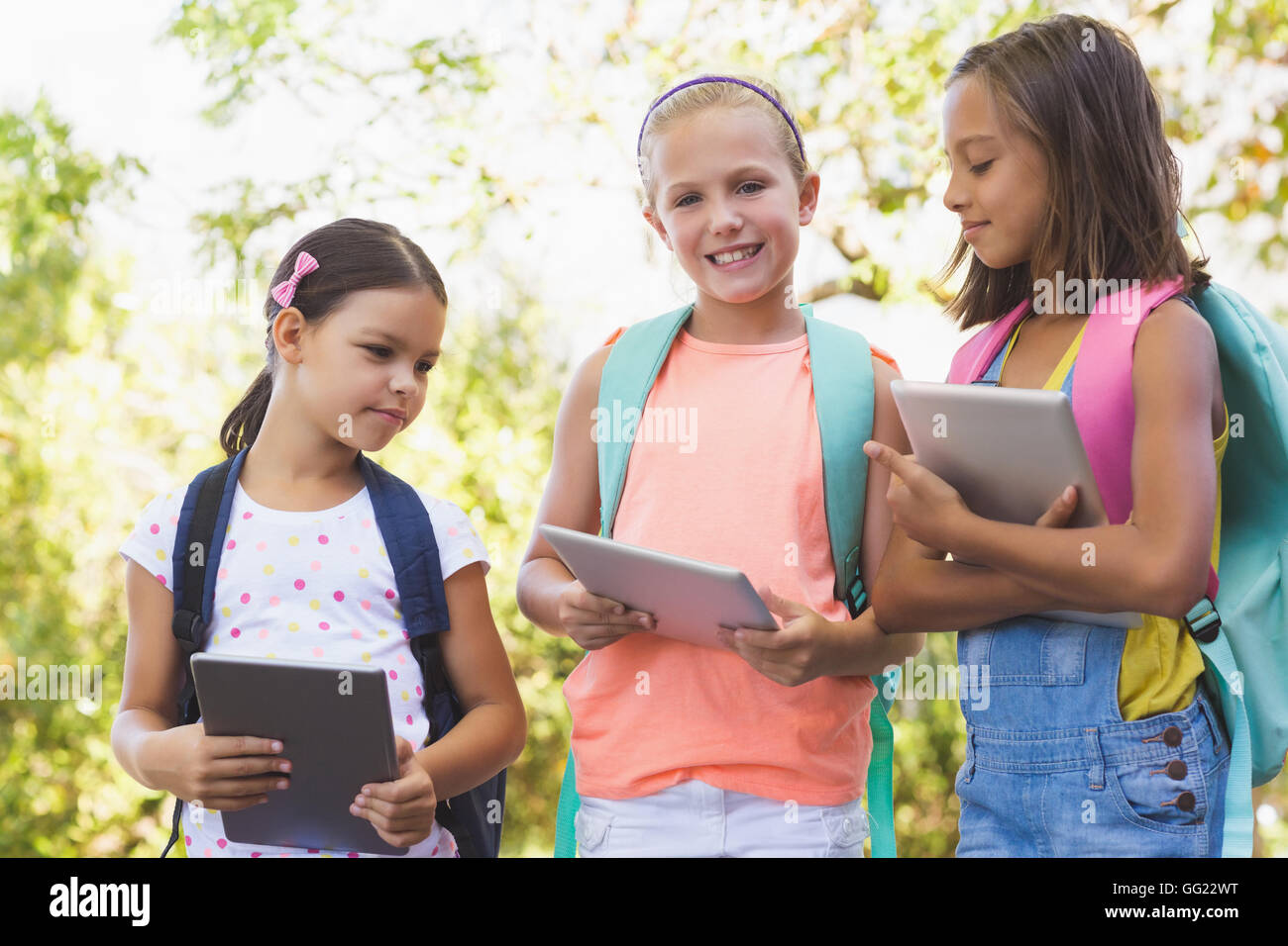 Portrait of school kids using digital tablet Stock Photo - Alamy