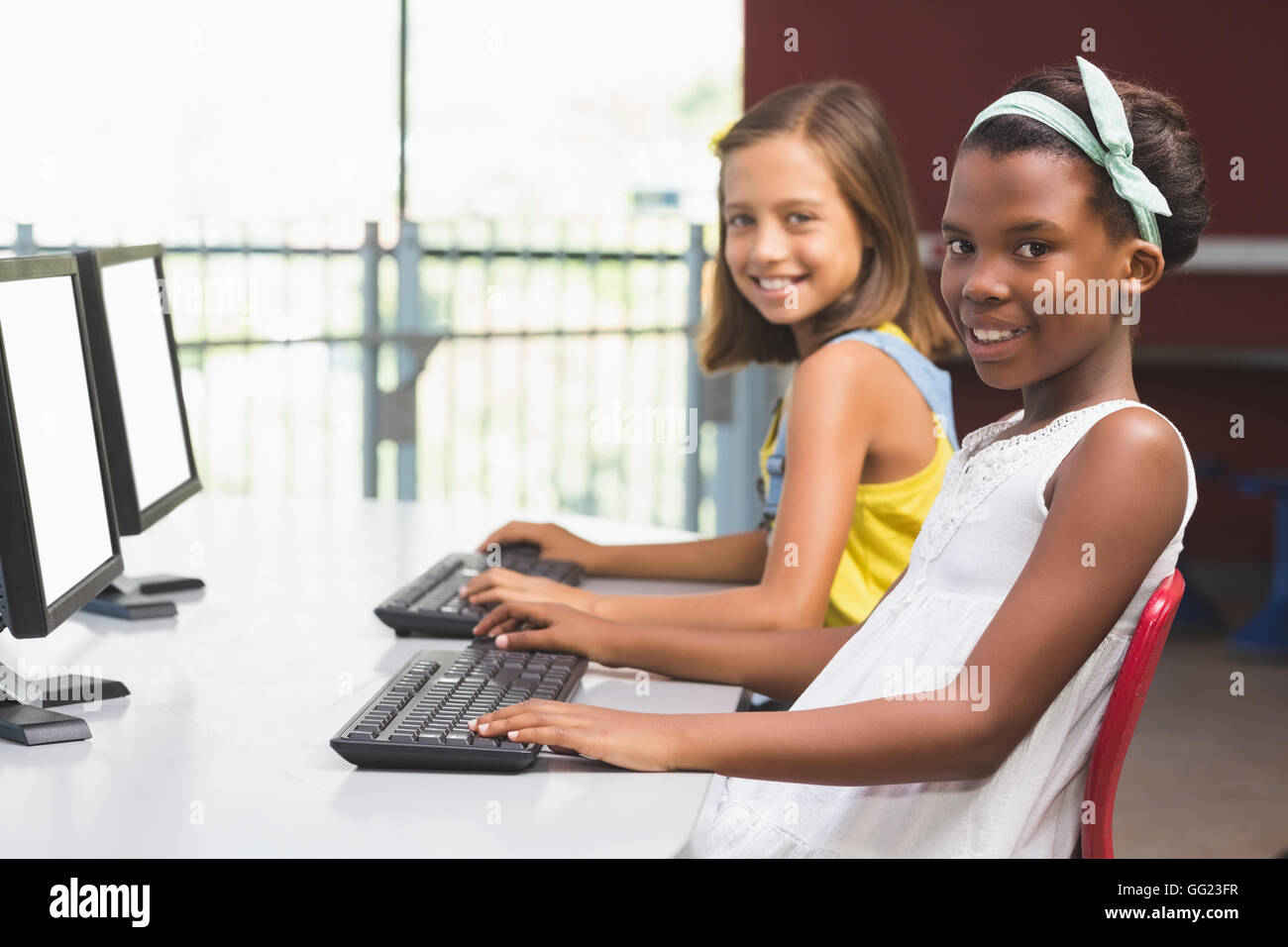 Adorable schoolgirls hi-res stock photography and images - Alamy