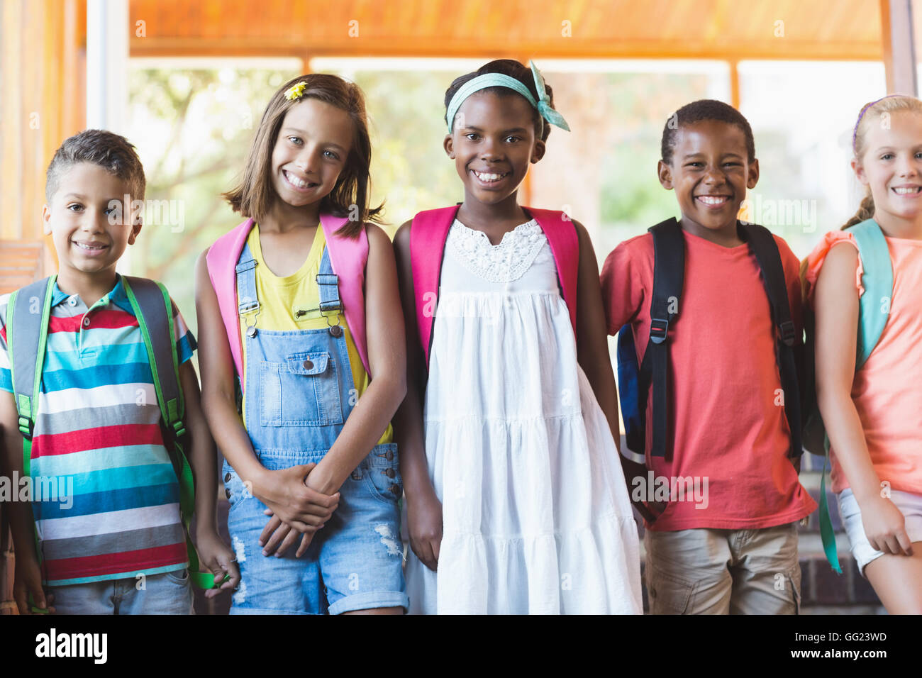 Group of smiling school kids standing in row Stock Photo - Alamy