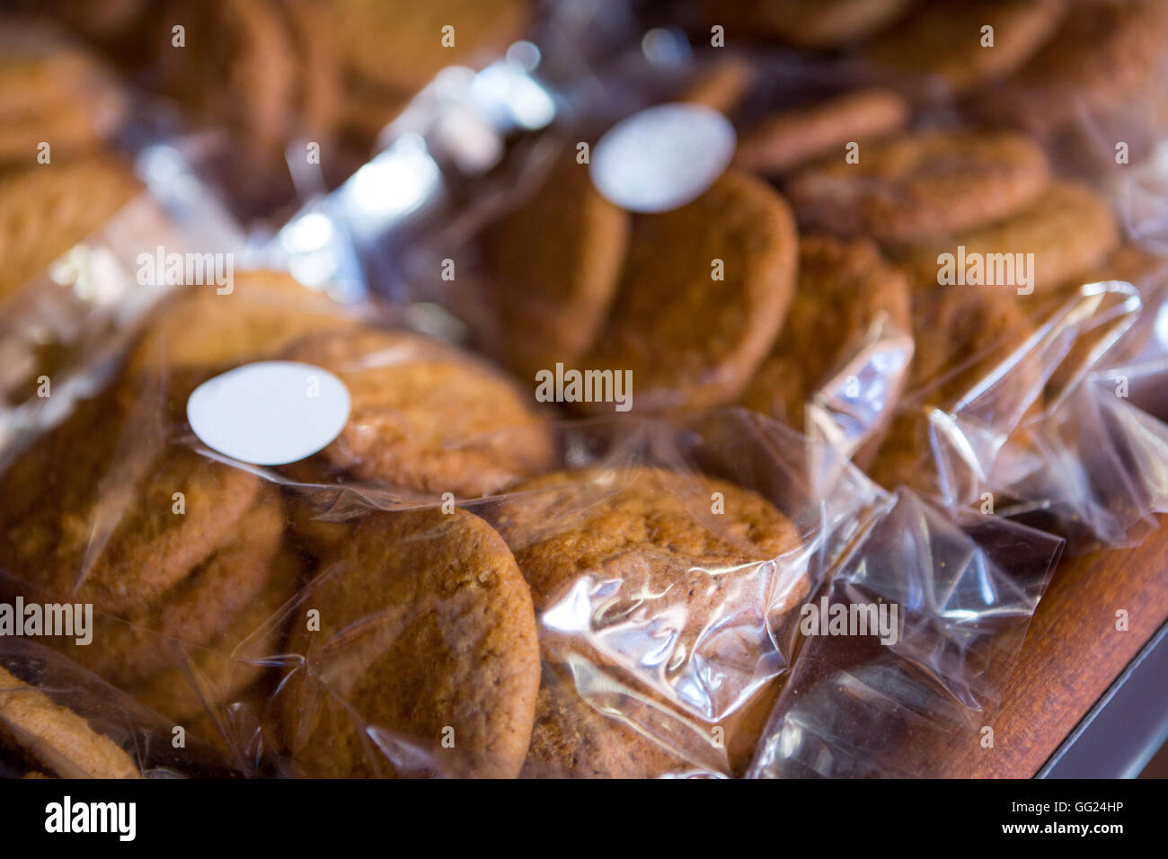 Packets of cookies on display shelf Stock Photo - Alamy