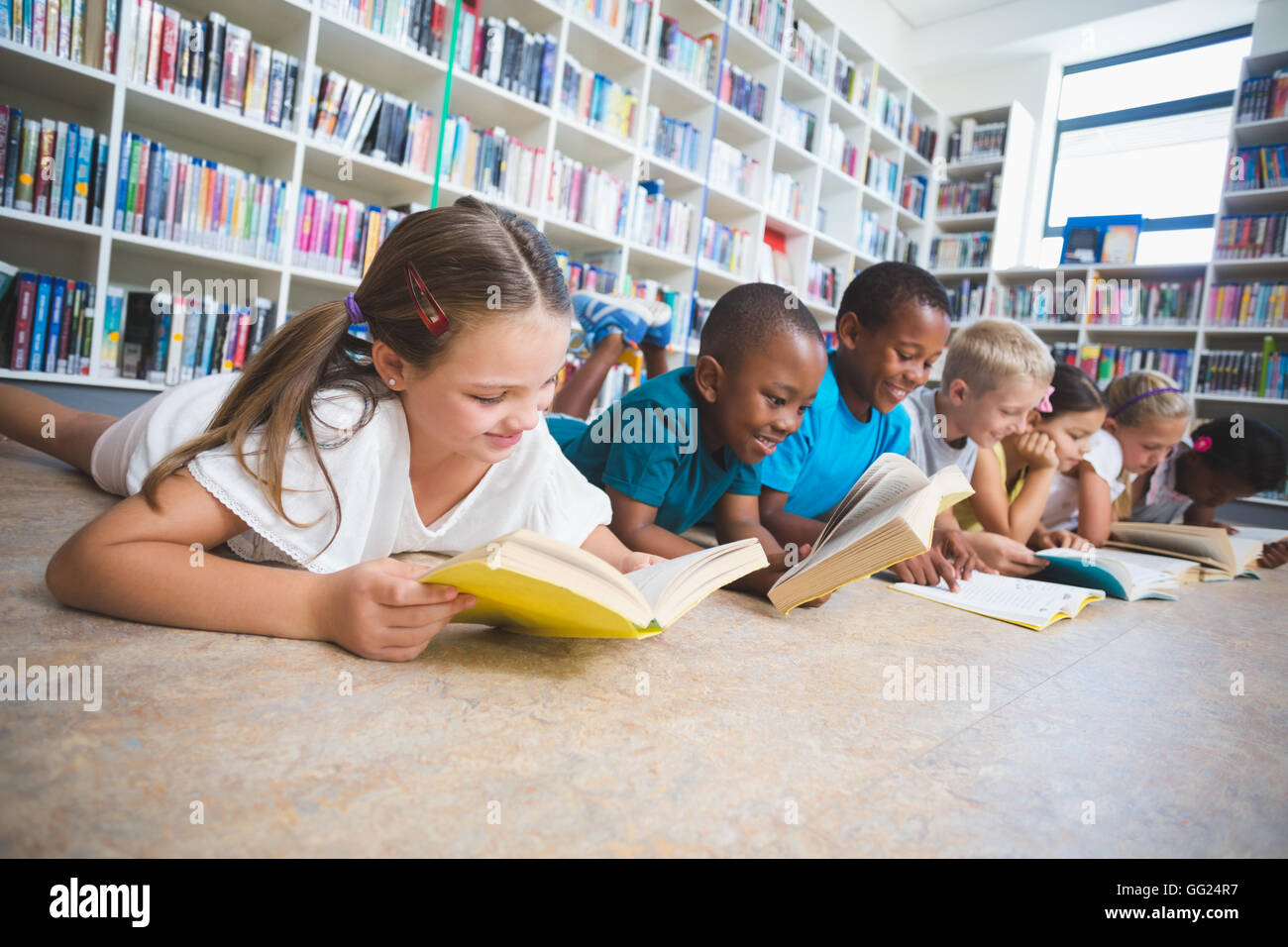 Asian boy reading floor hi-res stock photography and images - Alamy