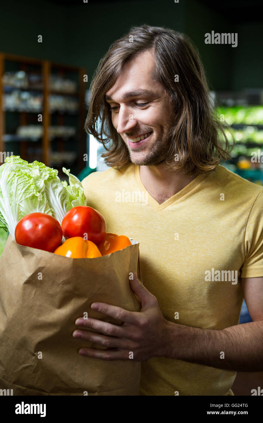 Man holding bag of vegetables Stock Photo - Alamy
