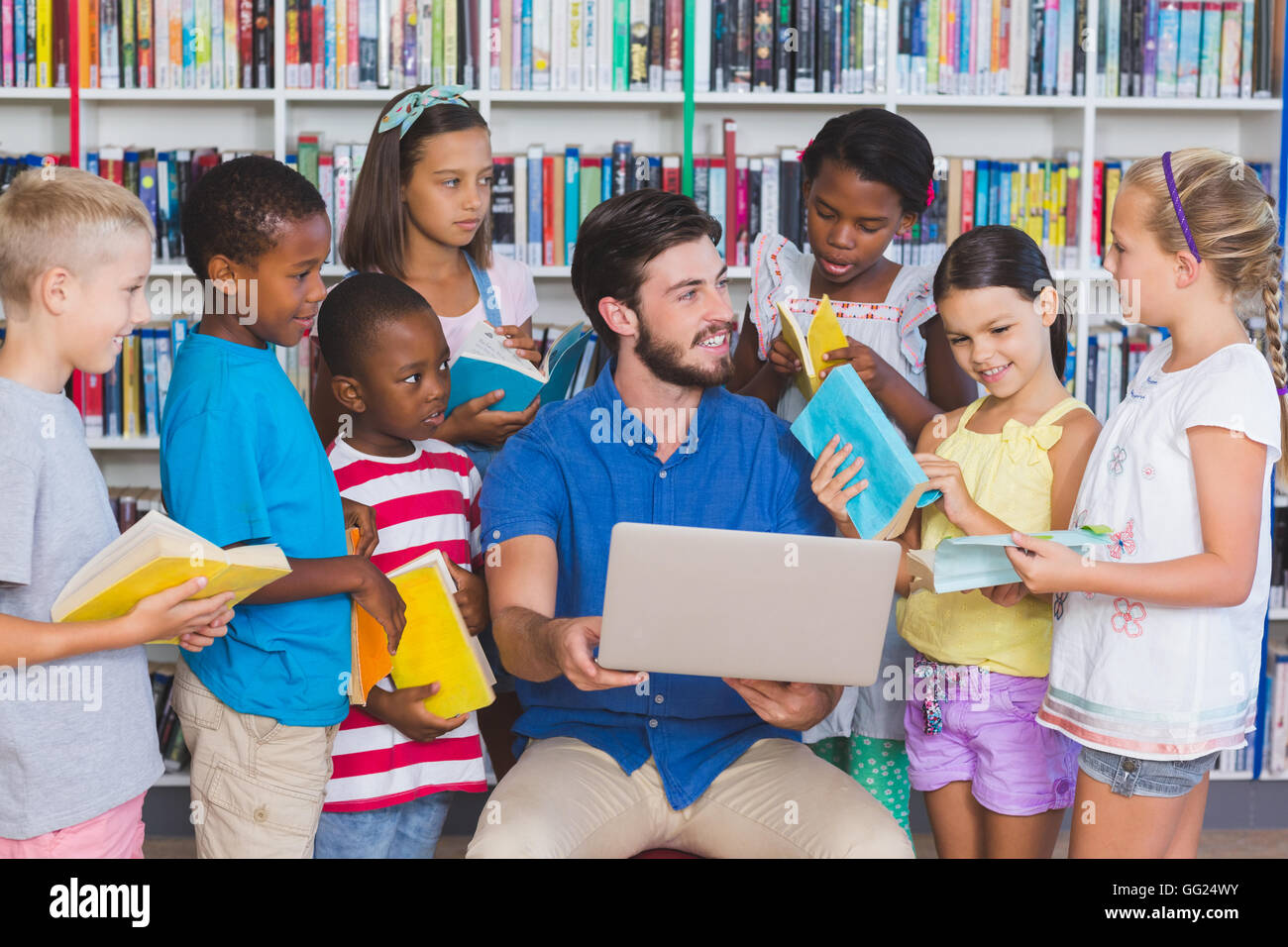Girl in a library on laptop hi-res stock photography and images - Alamy