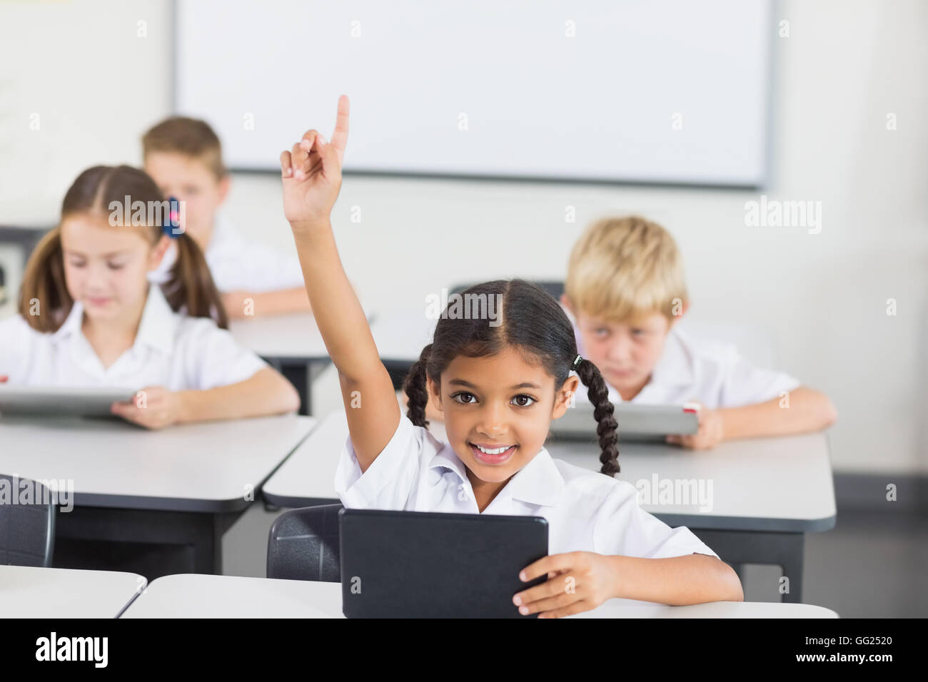 Boy raising hand computer class hi-res stock photography and images - Alamy