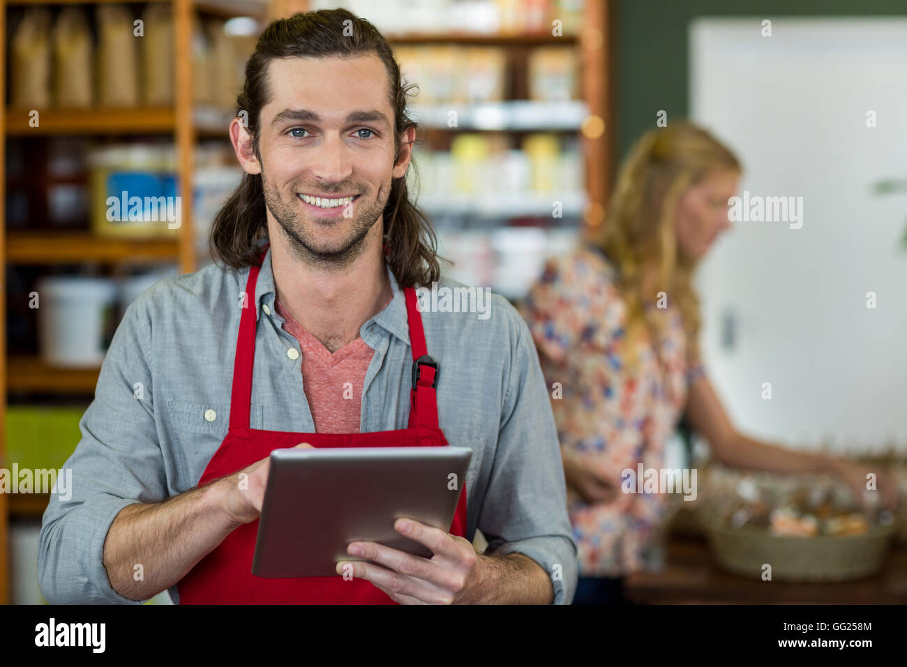 Portrait of smiling male staff using a digital tablet Stock Photo - Alamy