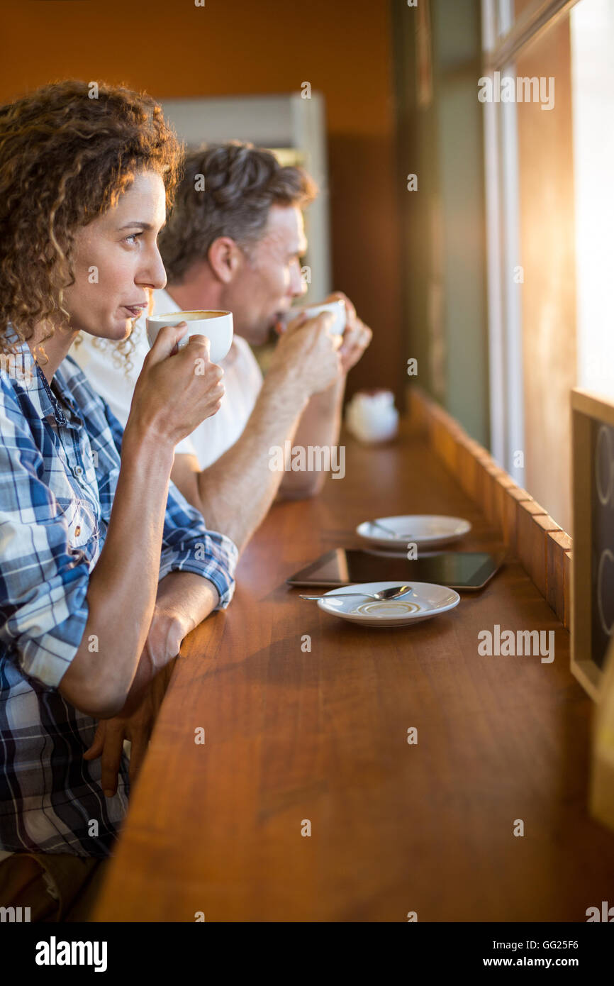 Couple having coffee in cafC Stock Photo - Alamy