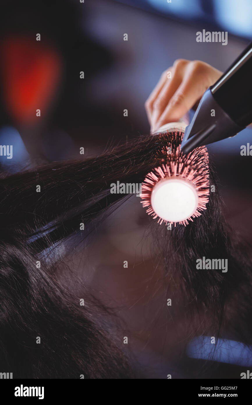 Woman getting her hair dried Stock Photo - Alamy