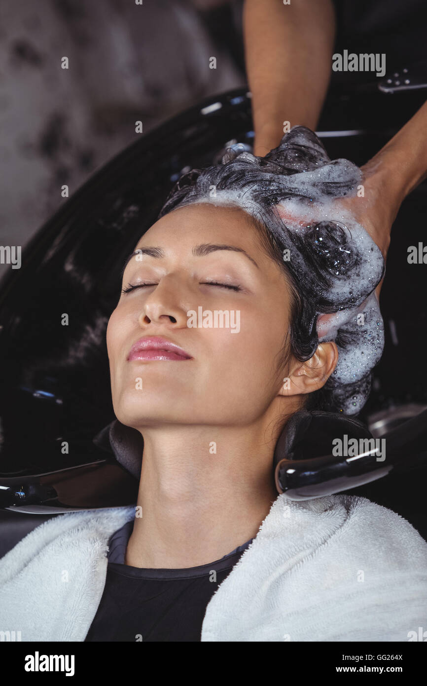 Woman getting her hair wash Stock Photo - Alamy