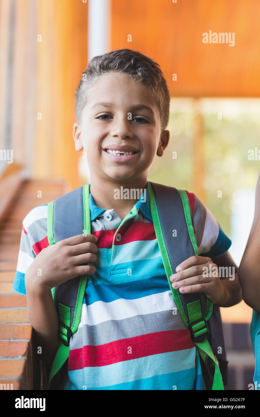 Portrait of school boy standing in school corridor Stock Photo - Alamy