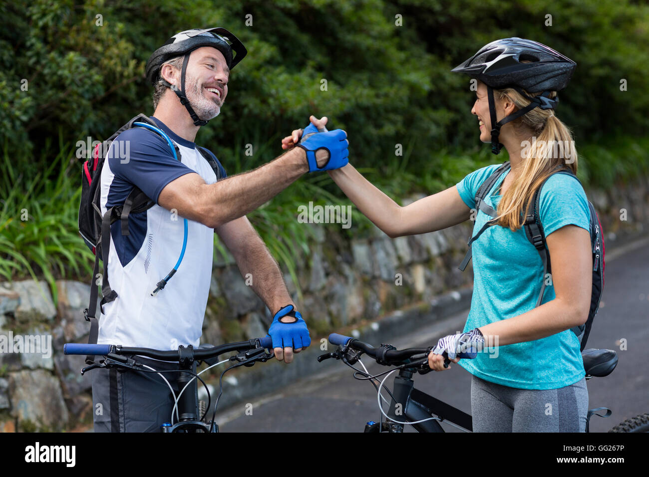 Bicycle holding hands hi-res stock photography and images - Alamy