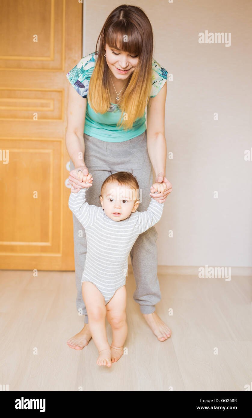 little child baby smiling making first steps Stock Photo - Alamy