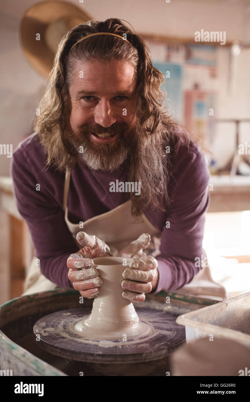 Male potter making pot Stock Photo - Alamy