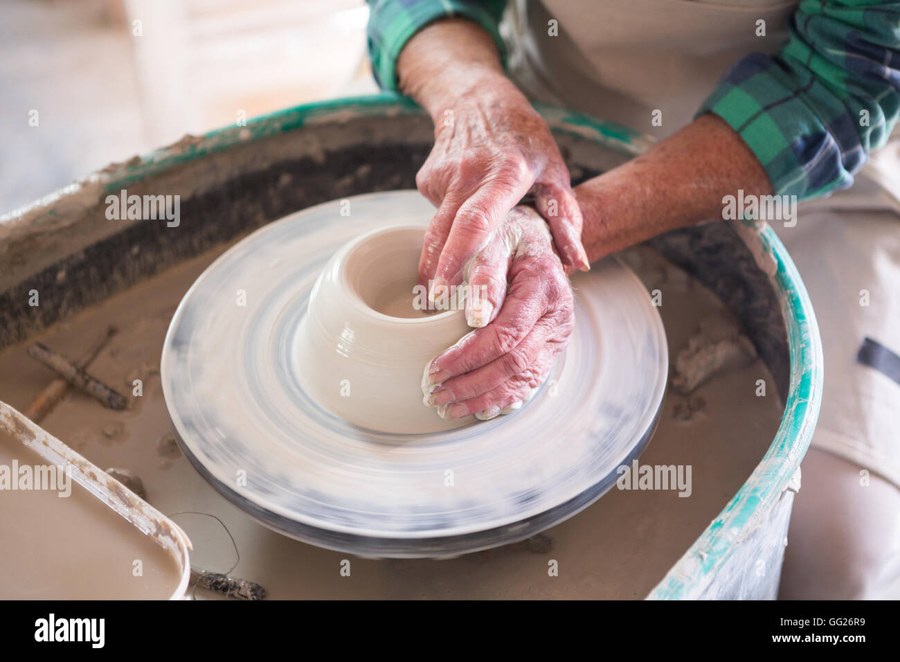 Mid section of potter making pot Stock Photo - Alamy