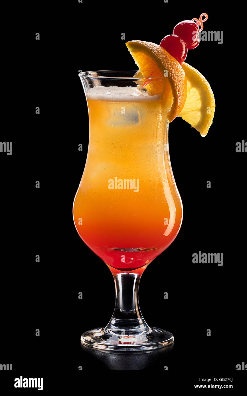 Fresh orange cocktail in a glass decorated with cherry and two slices ...
