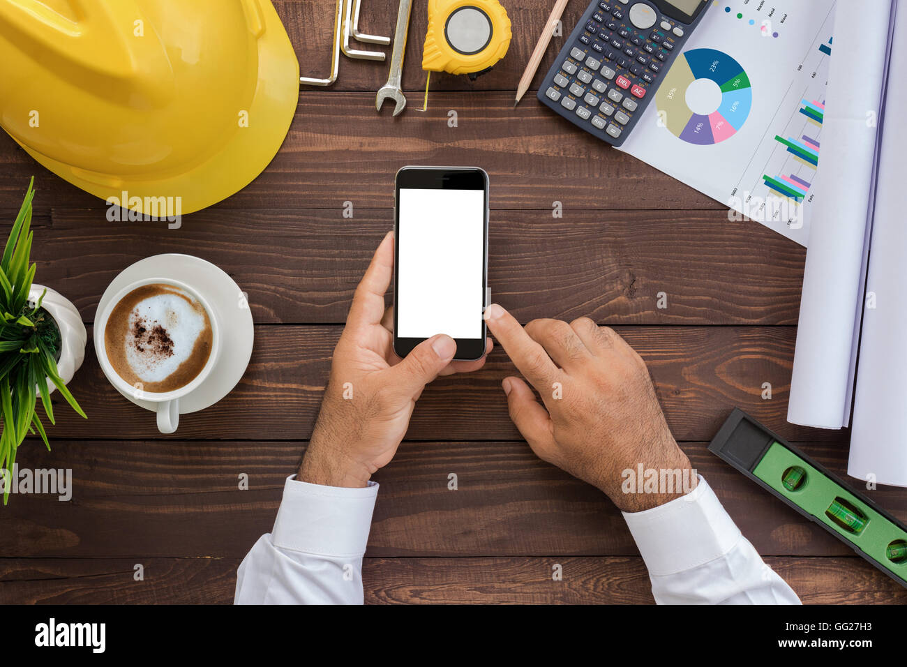 engineering using phone on his workspace top view Stock Photo - Alamy
