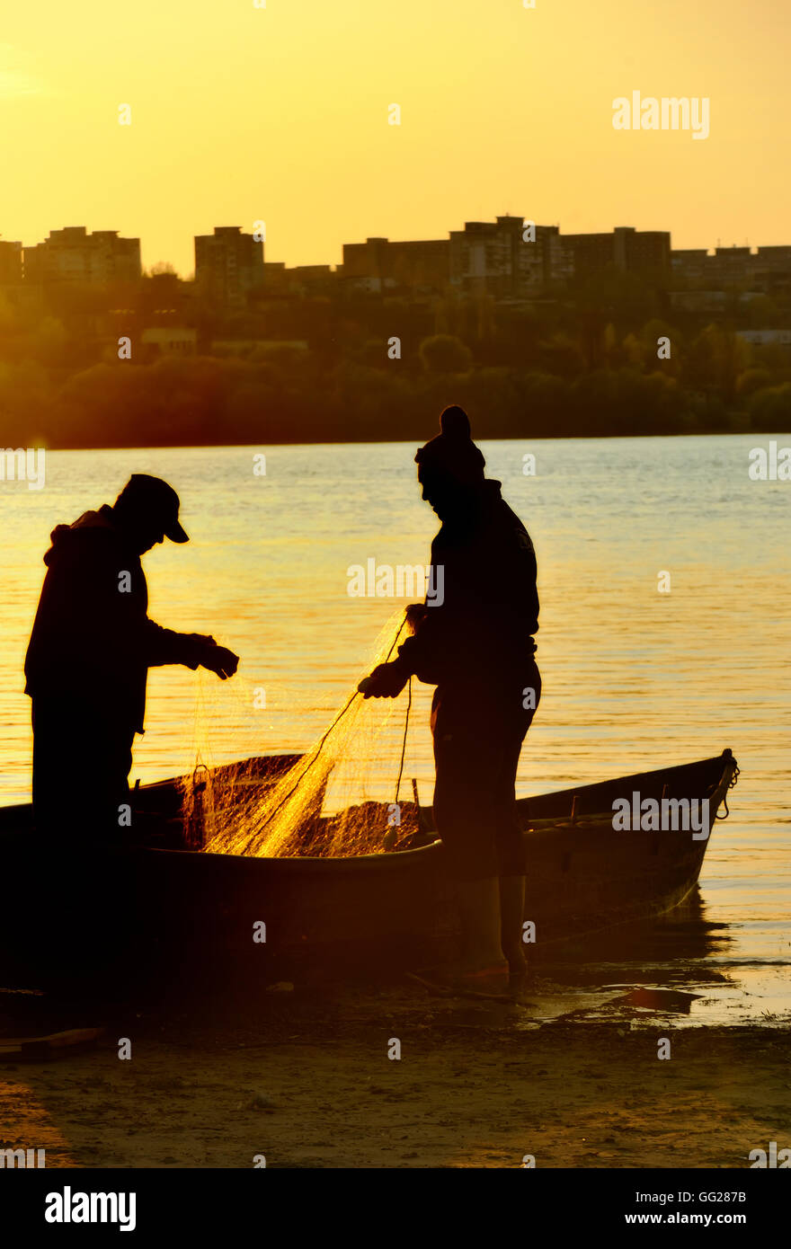 Silhouette fishermen sunset hi-res stock photography and images - Alamy