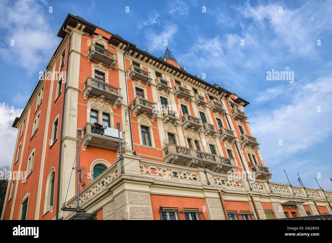 Bright orange building in Como, Italy Stock Photo - Alamy