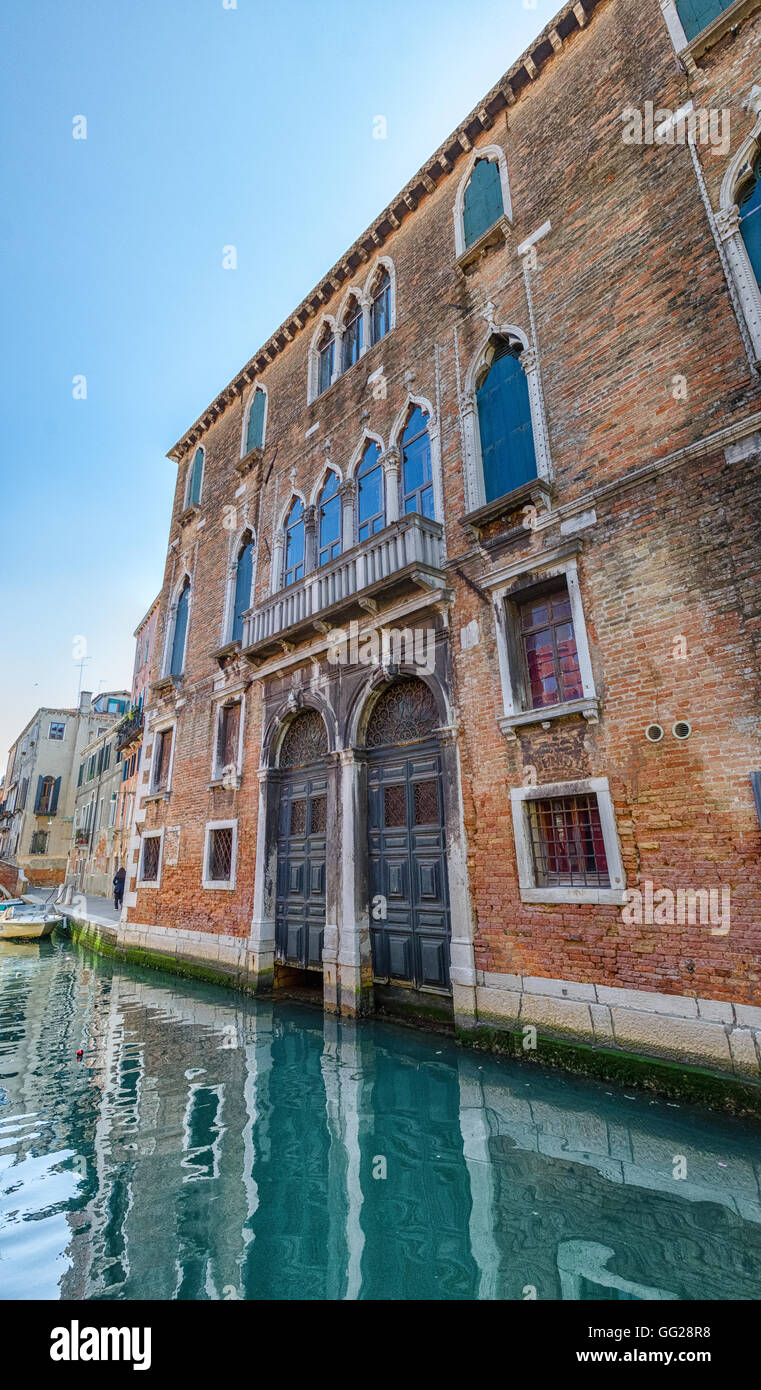 Facade of a red brick house in Venice, Italy Stock Photo - Alamy