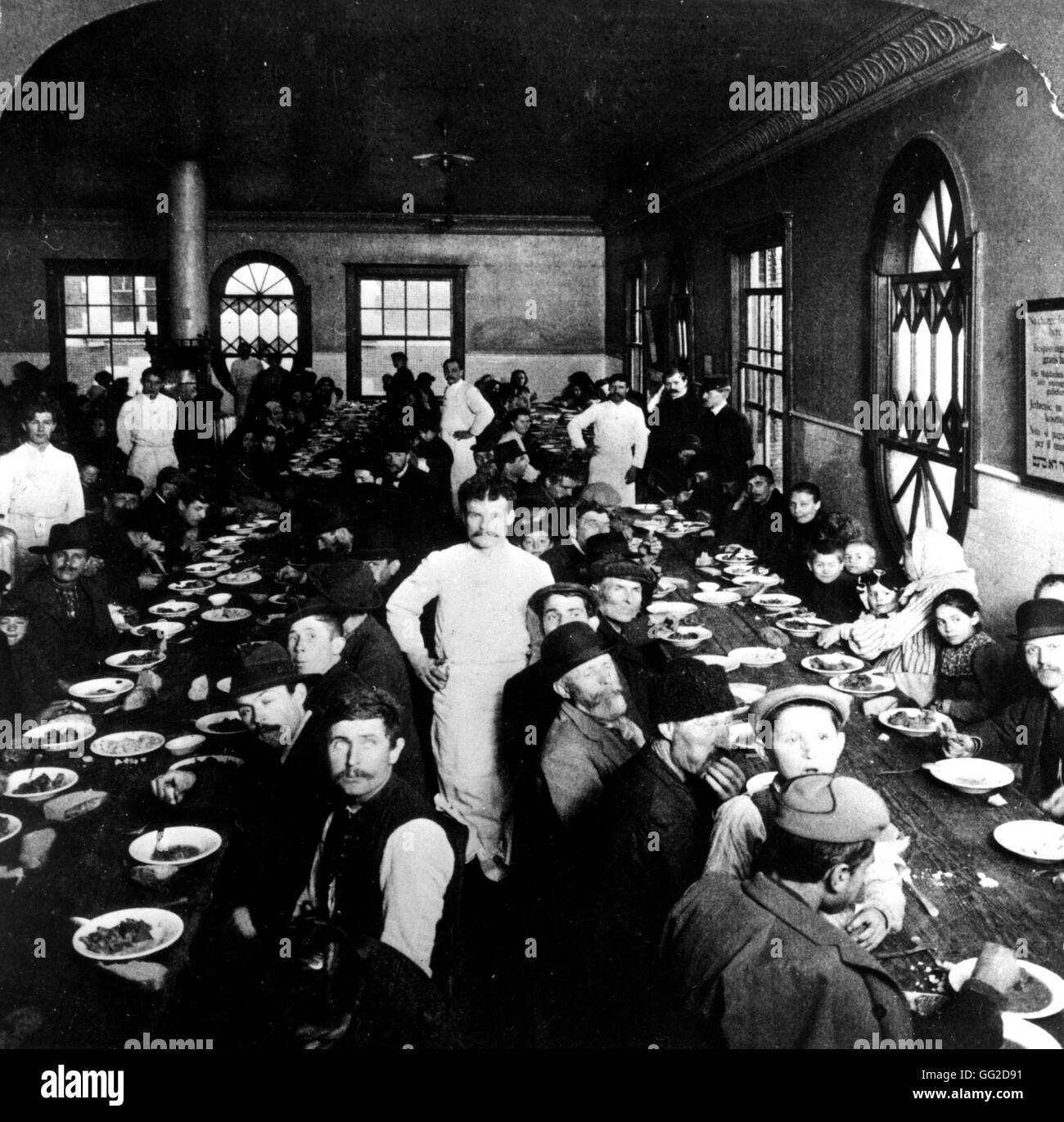 Immigrants eating in cafeteria just after their arrival Around 1900 ...