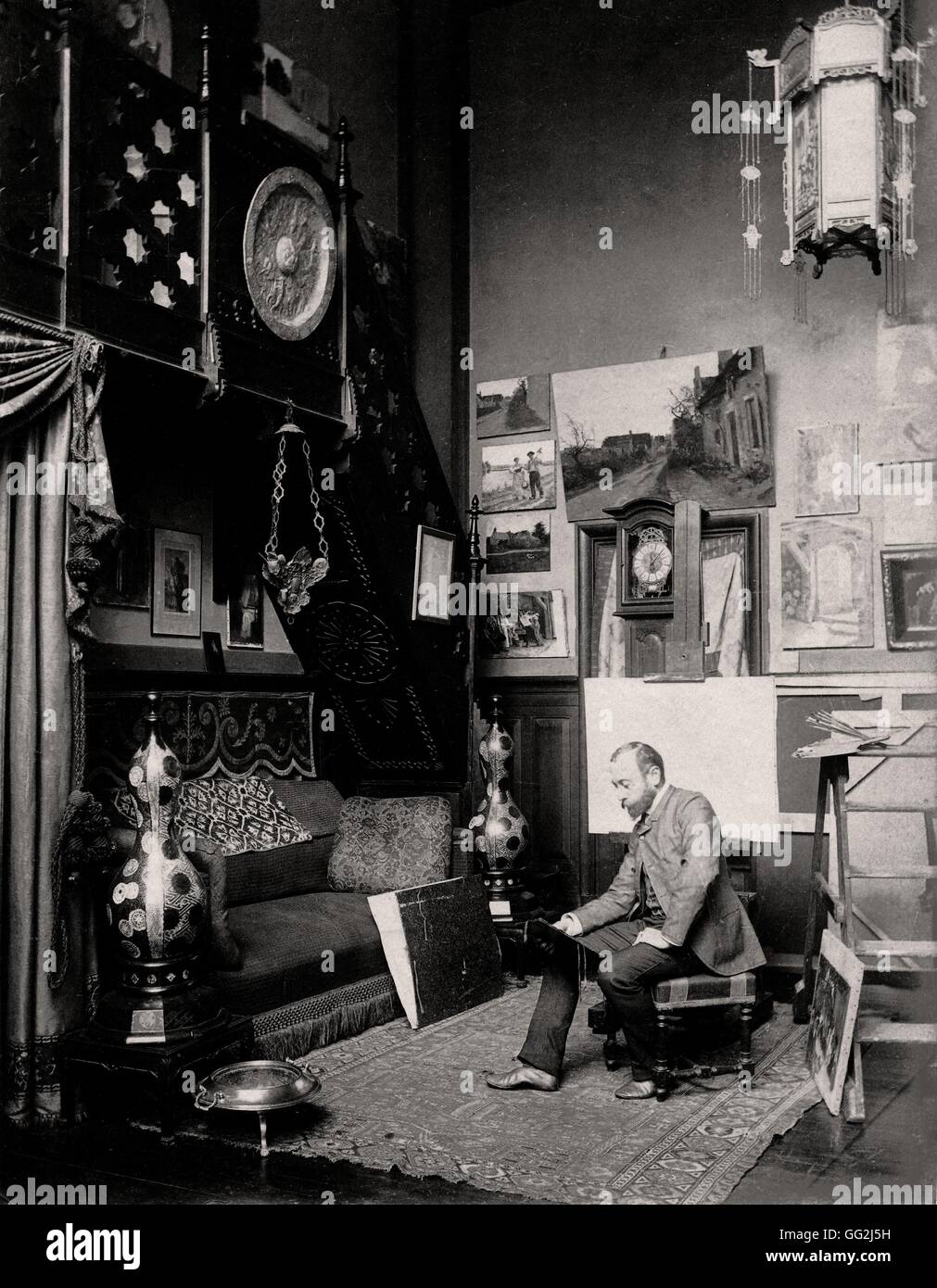 French painter and illustrator Albert Fourié in his studio in Paris ...