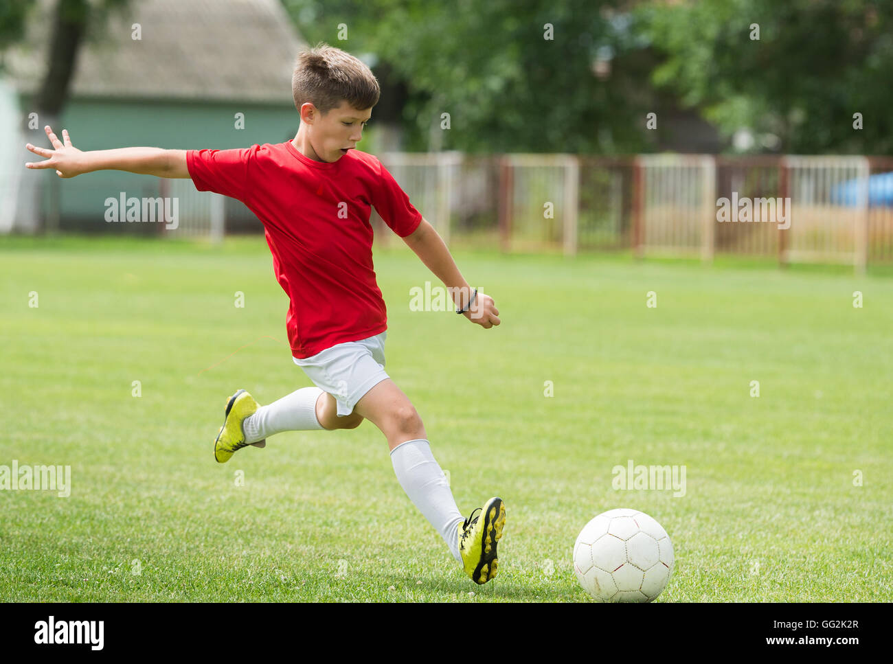 Little Boy Shooting at Goal Stock Photo - Alamy