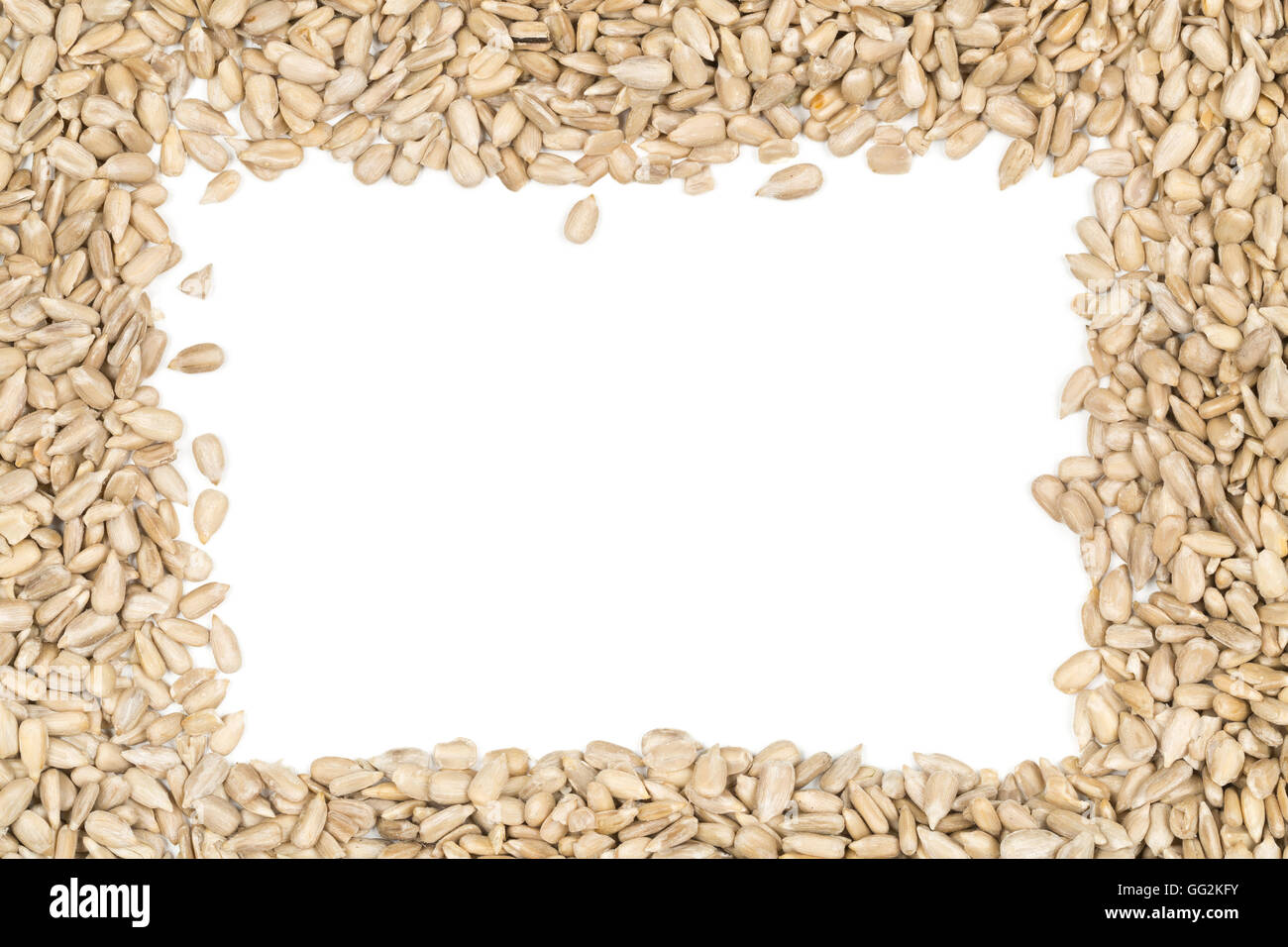 Natural shelled sunflower seeds frame over white background Stock Photo ...