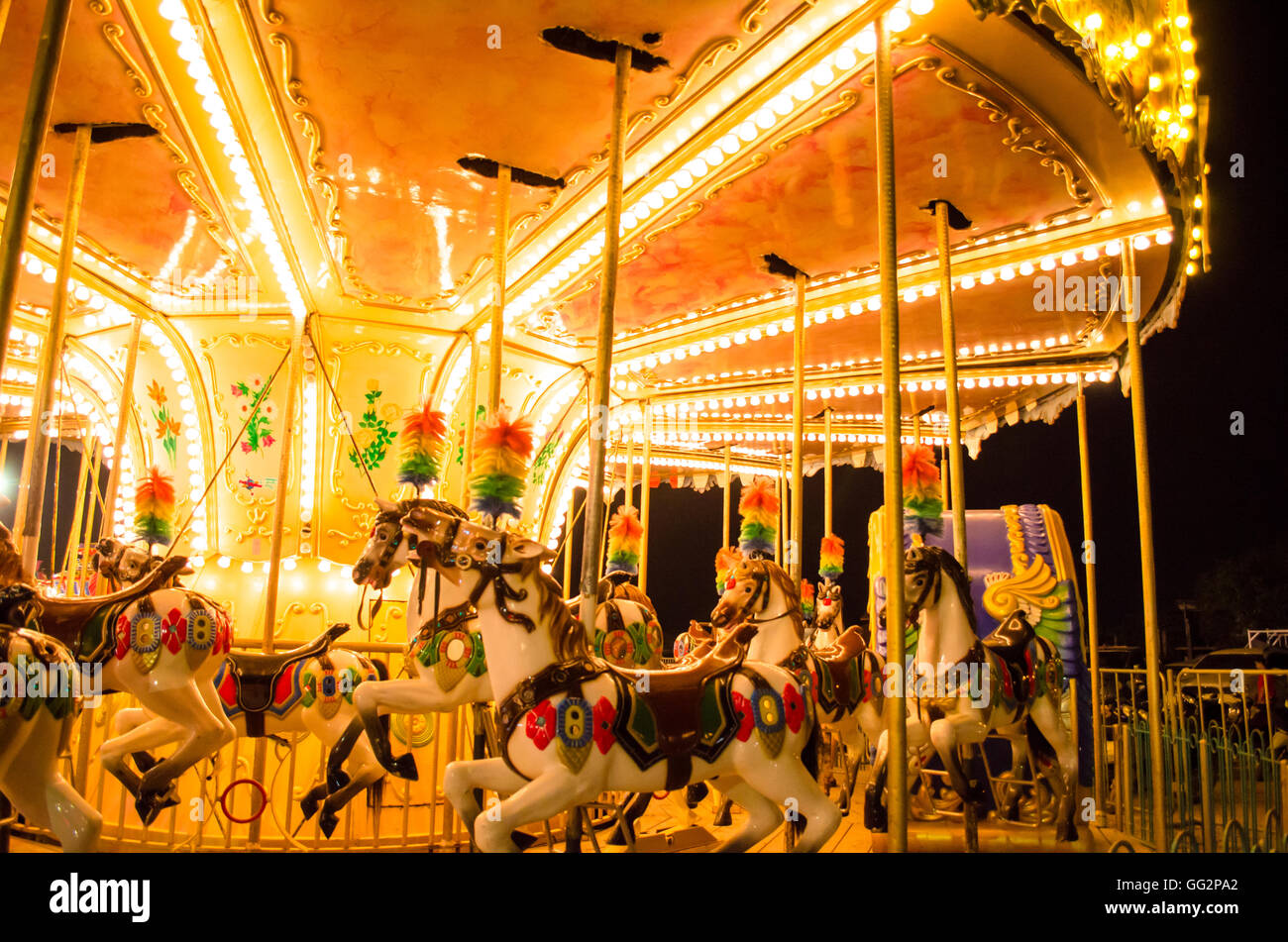 Merry go round night park hi-res stock photography and images - Alamy